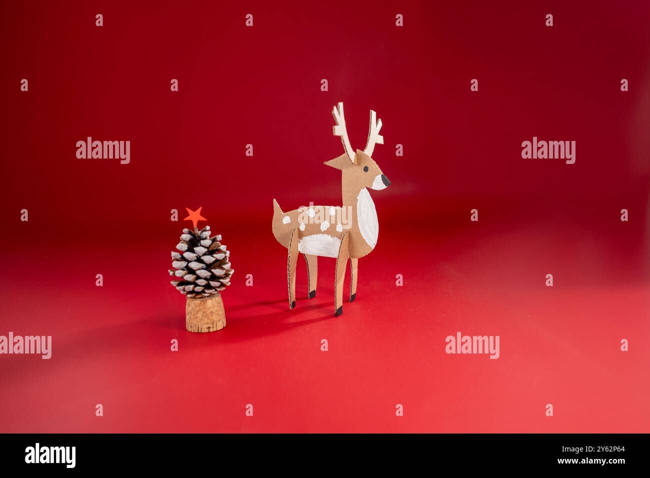 Festive holiday display on red background featuring recycling paper ...