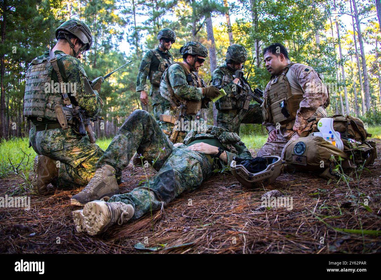 U.S. Navy Hospital Corpsman 3rd Class Joshua Anchanzar, right, with 2nd ...