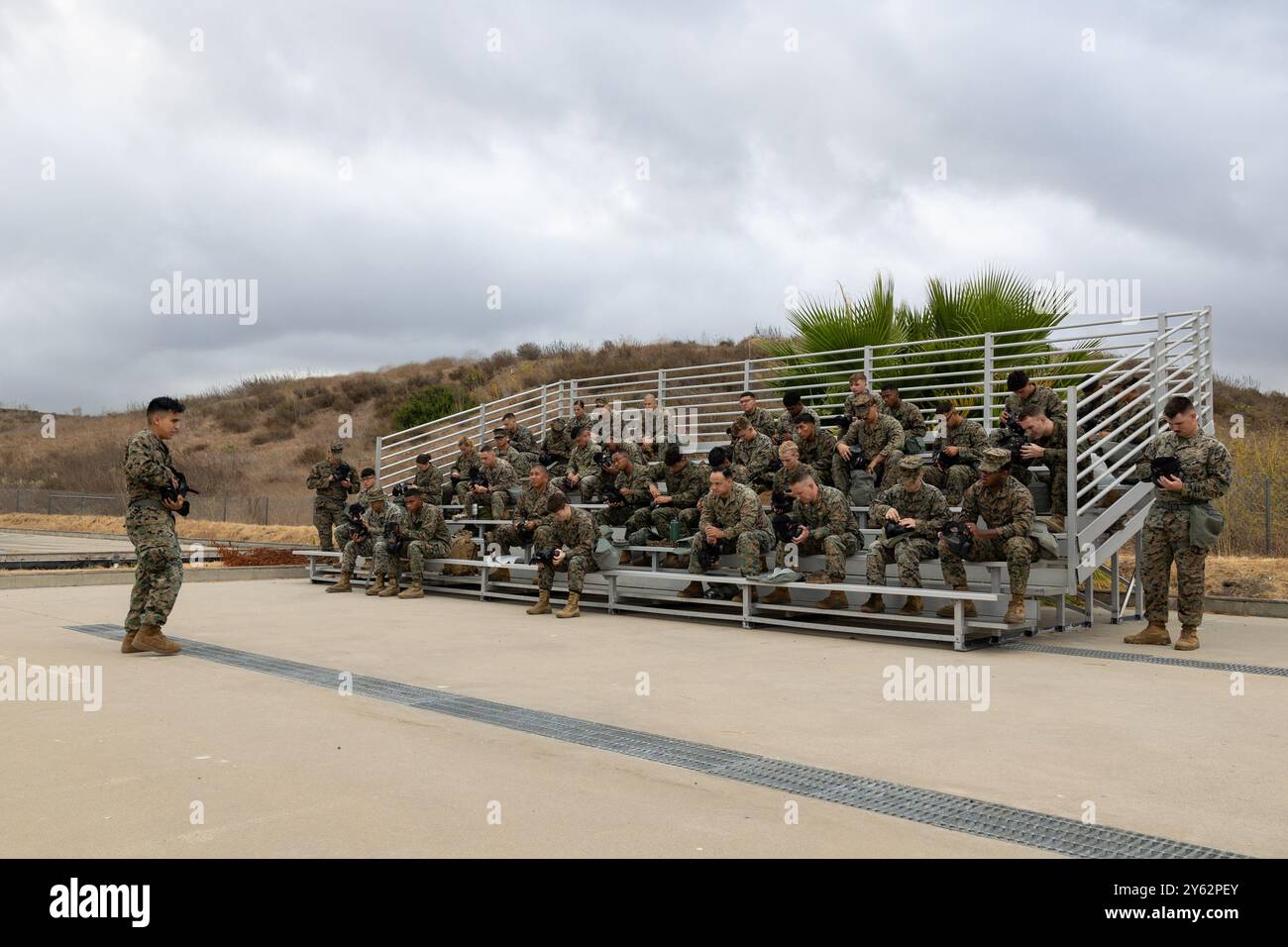 U.S. Marine Corps Lance Cpl. Carlos Sandoval, left, a chemical ...