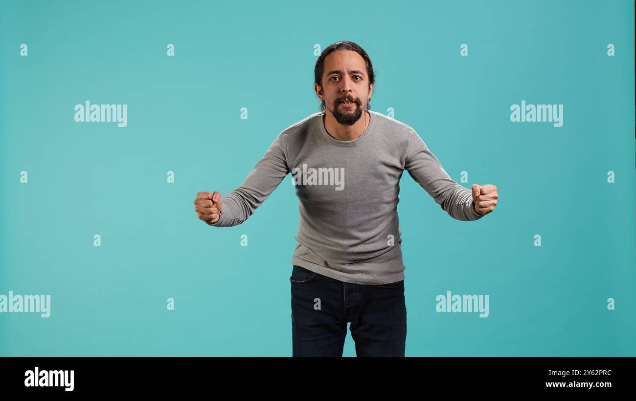 Portrait of irate man feeling outraged, yelling at friend, releasing ...