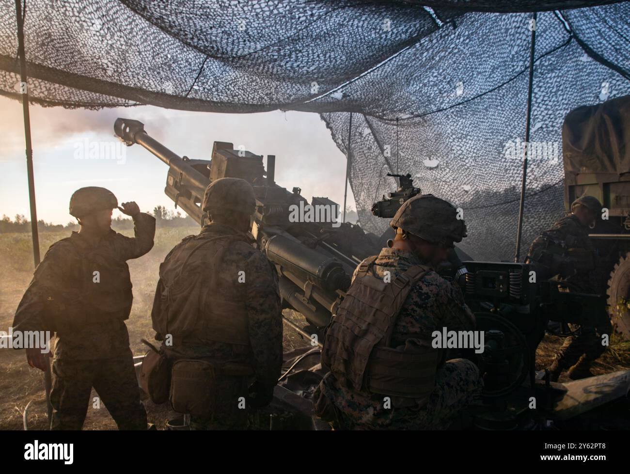 U.S. Marines fire a volley of artillery using an M777 Howitzer during ...