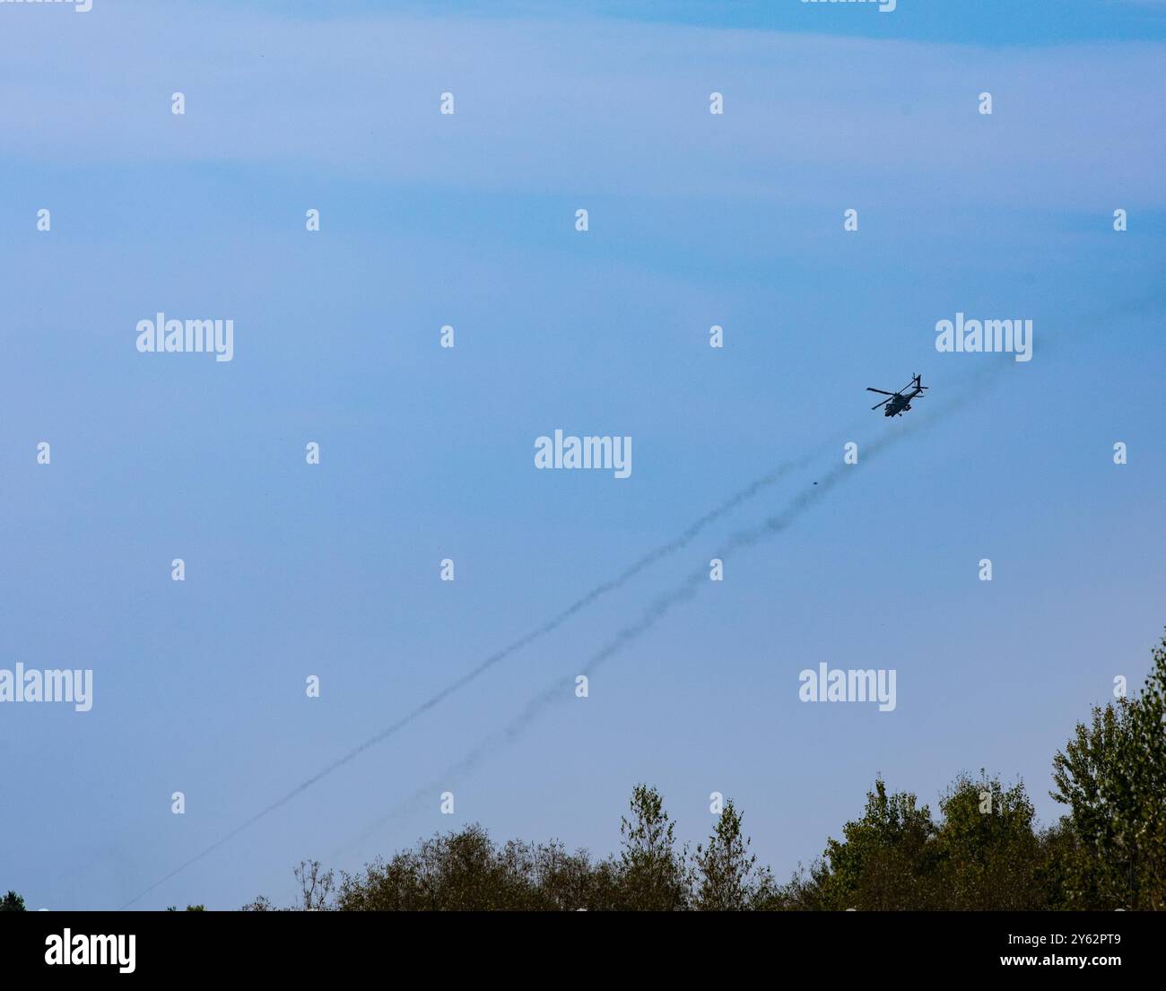 U.S. Soldiers fire missiles from an AH-64 Apache aircraft during an ...