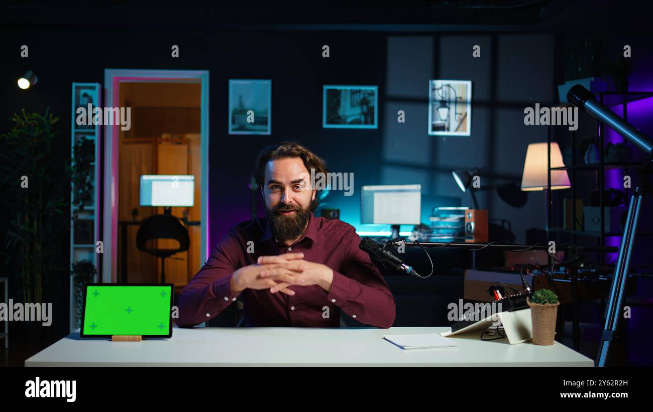 Tech specialist presenting mockup tablet to interested viewers, filming ...