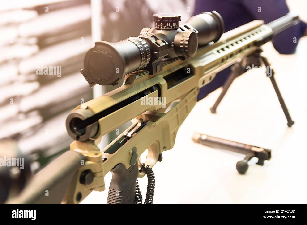An automatic rifle with an optical sight on the counter of a gun store ...