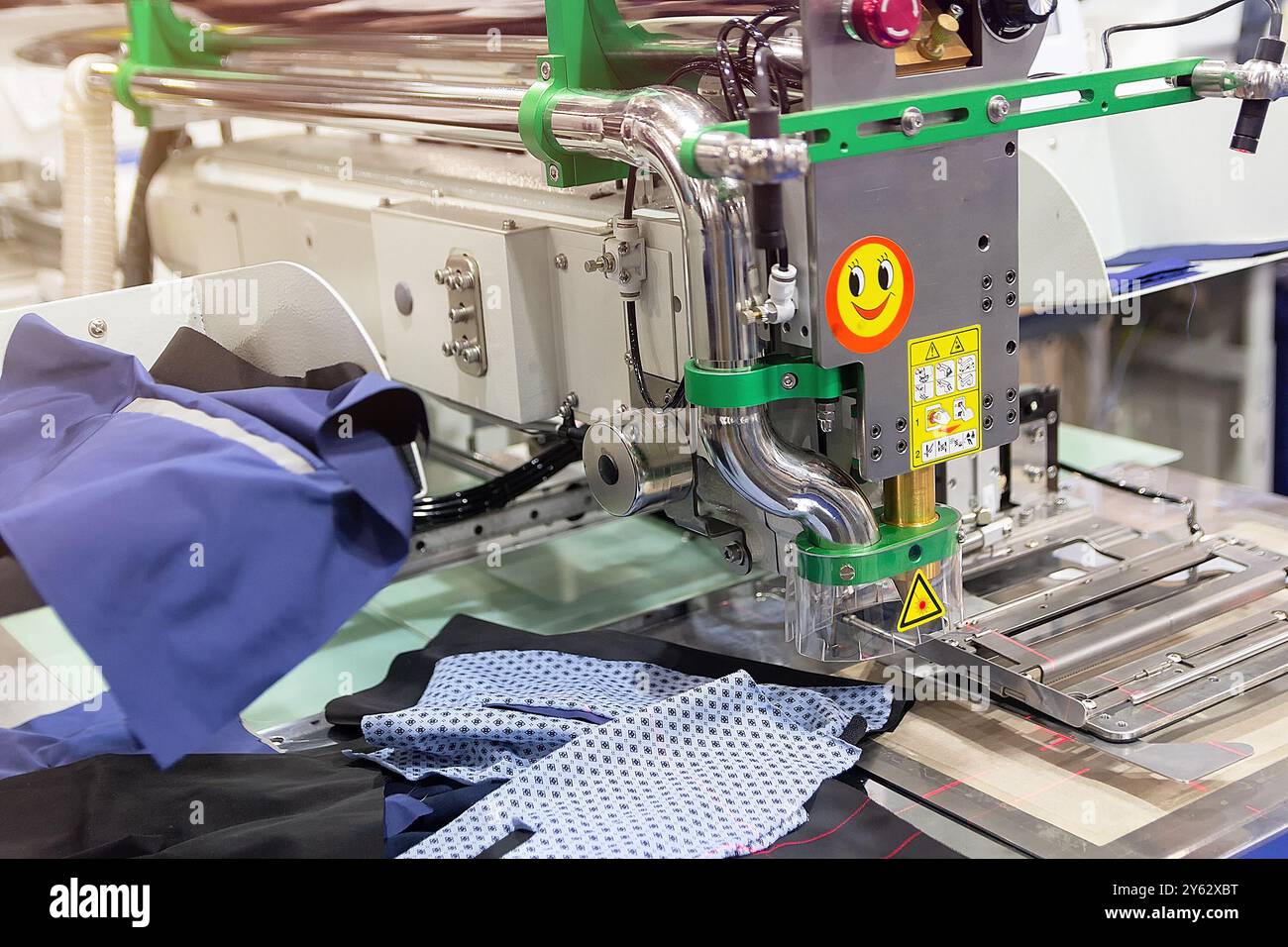 Modern embroidery machine in garment indystry. Clothing factory Stock ...