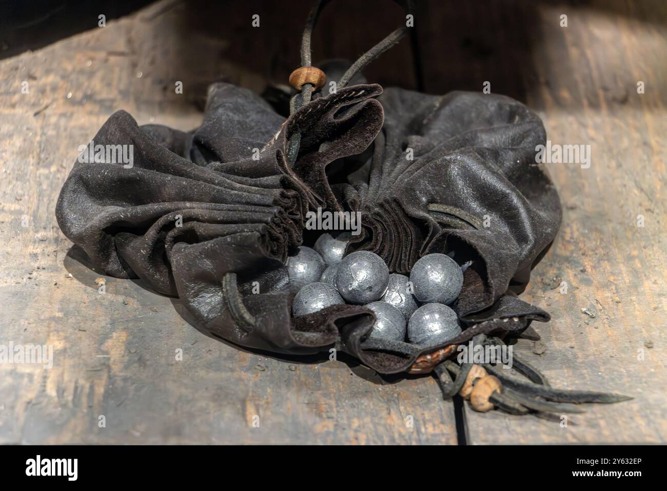 Bullets for a medieval firearm in a small leather sack Stock Photo - Alamy