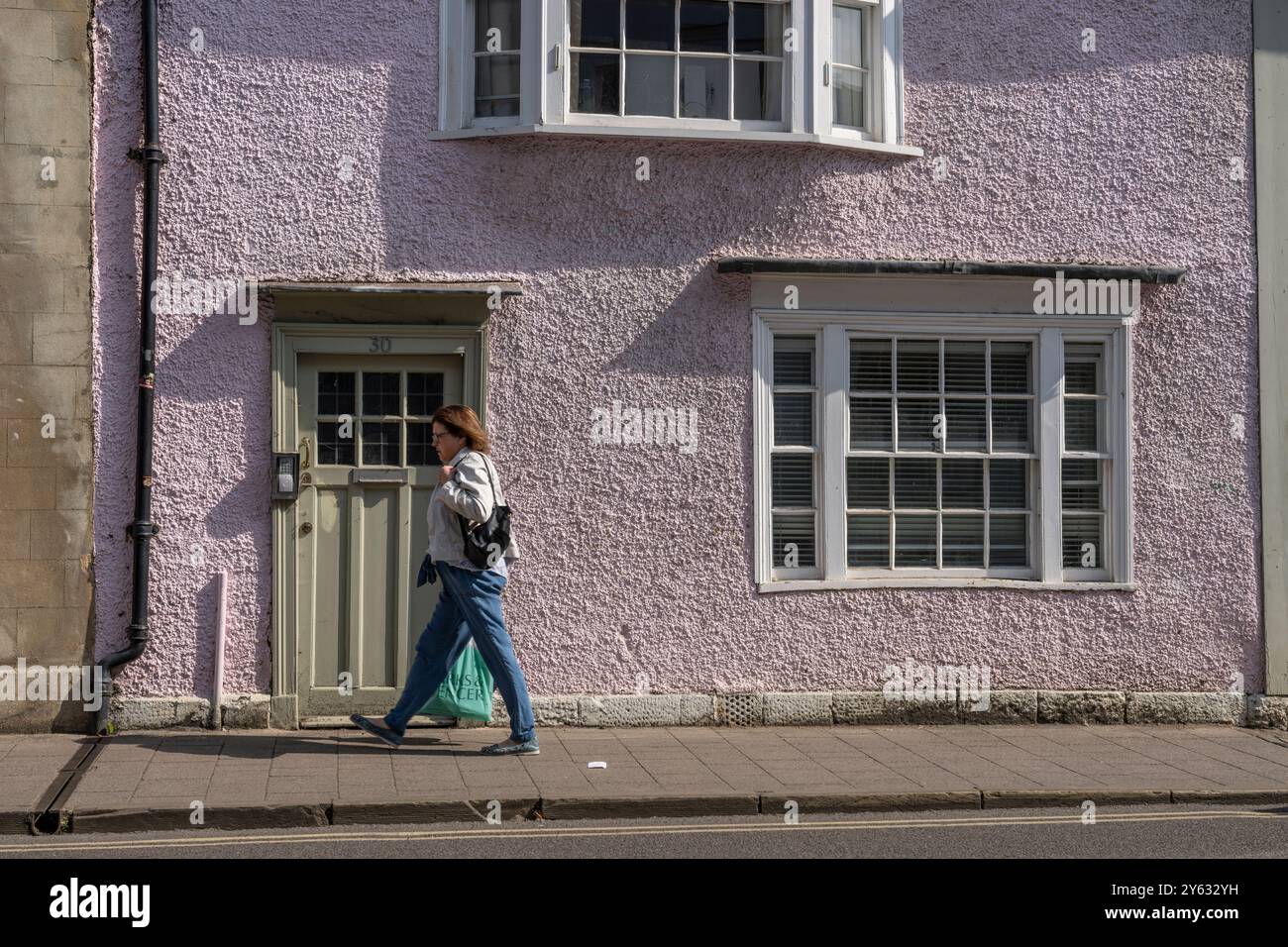 Oxford United Kingdom - July 24 2024; Woman waling in street scene ...