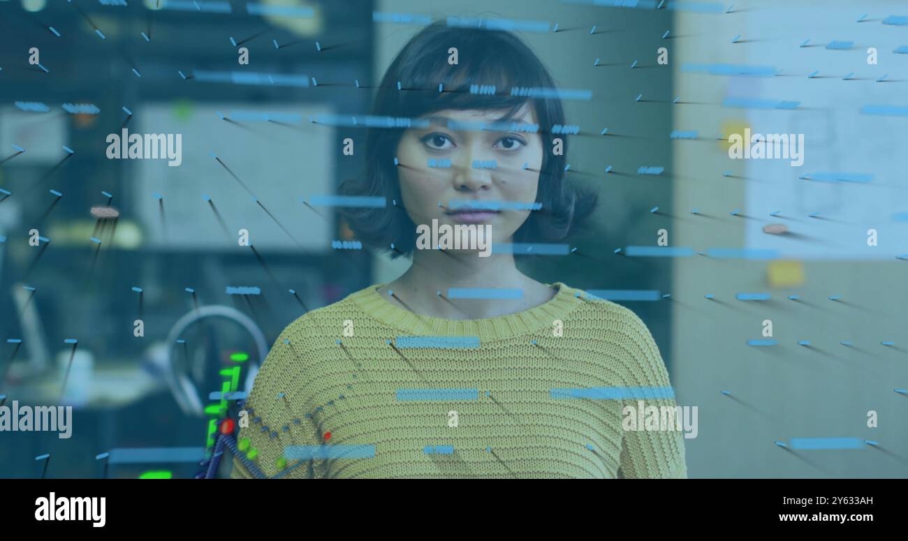 Data visualization image over woman in yellow sweater looking forward ...