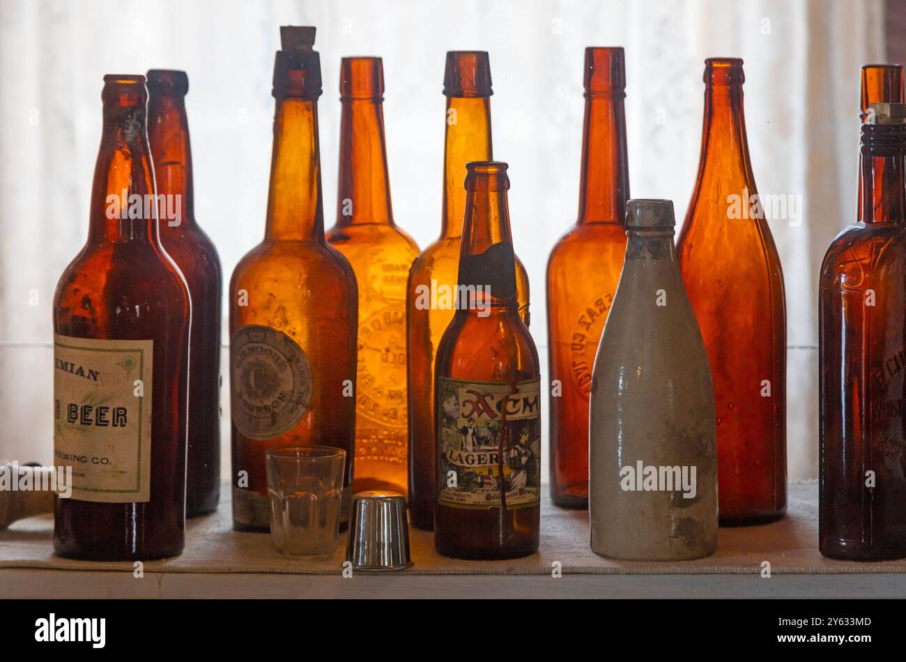 Old bottles line a shelf in Bodie California the most well preserved ...