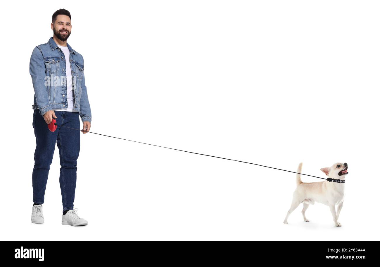 Young man walking his dog on white background Stock Photo - Alamy