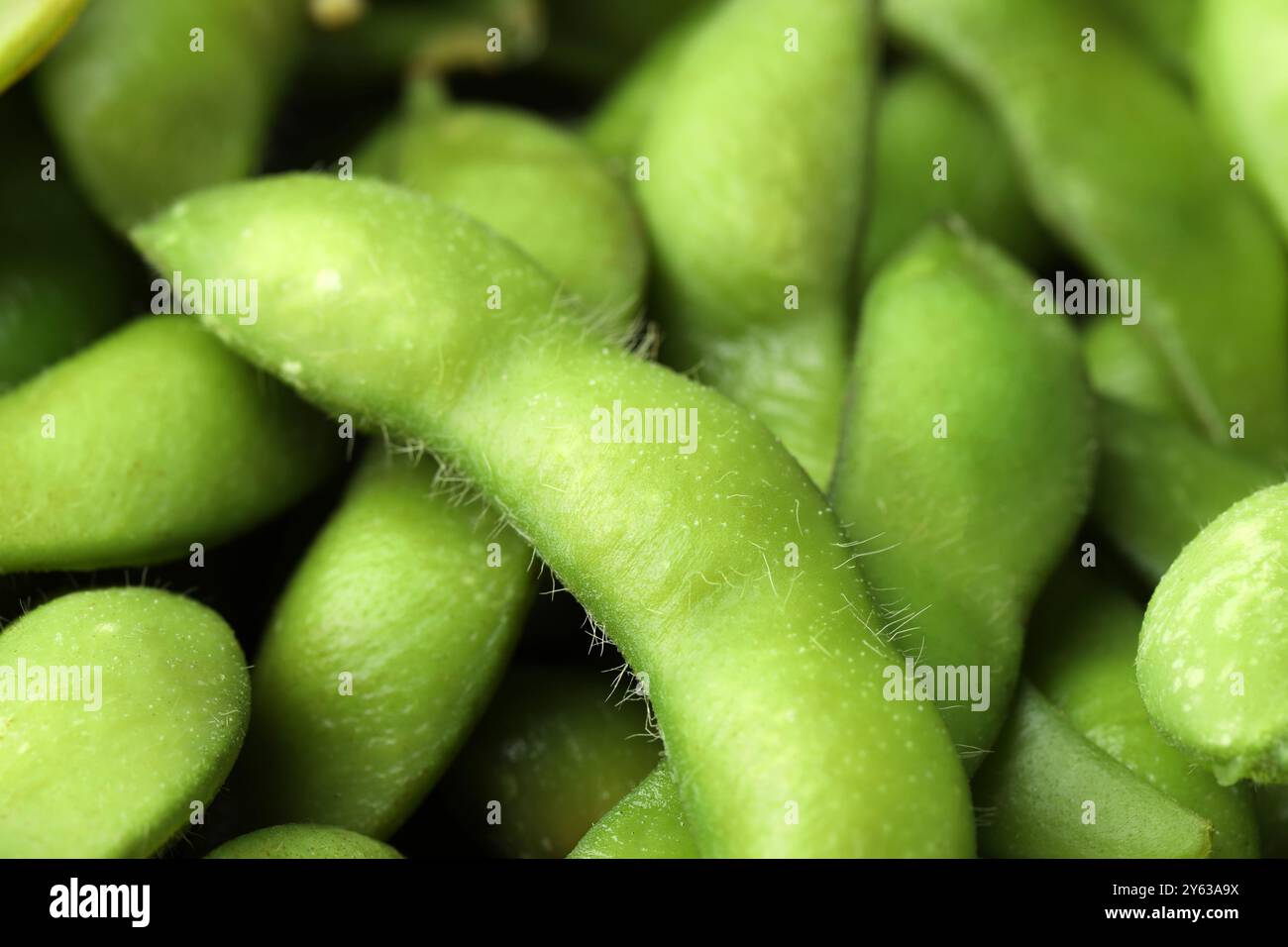 Fresh edamame pods as background, closeup view Stock Photo - Alamy