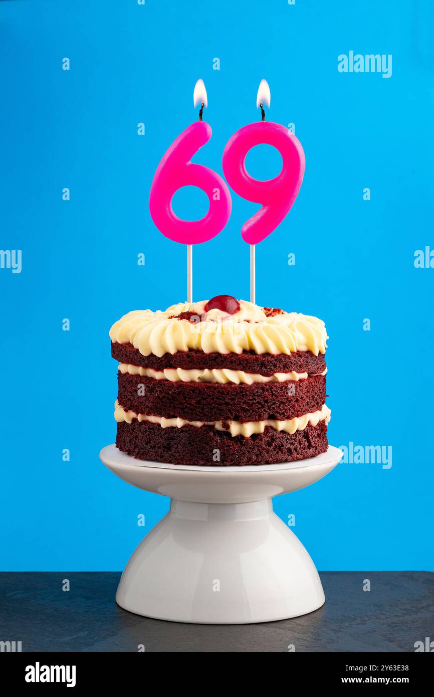 Birthday number 69 - Candle with red velvet cake Stock Photo - Alamy