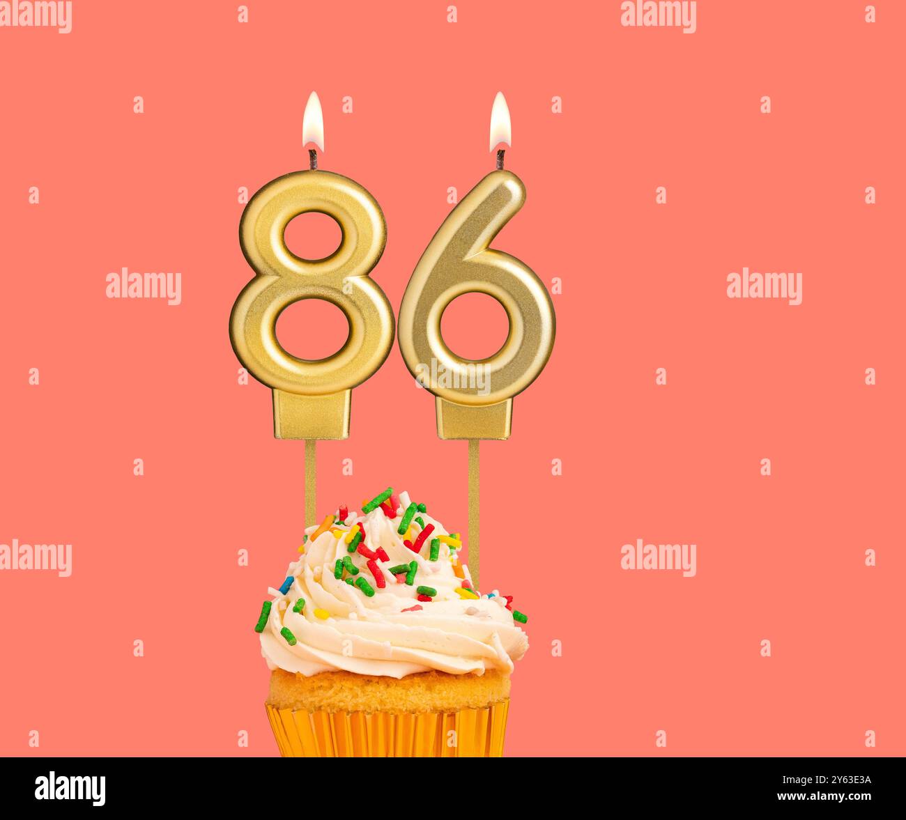 Birthday candle and cupcake - Number 86 Stock Photo - Alamy