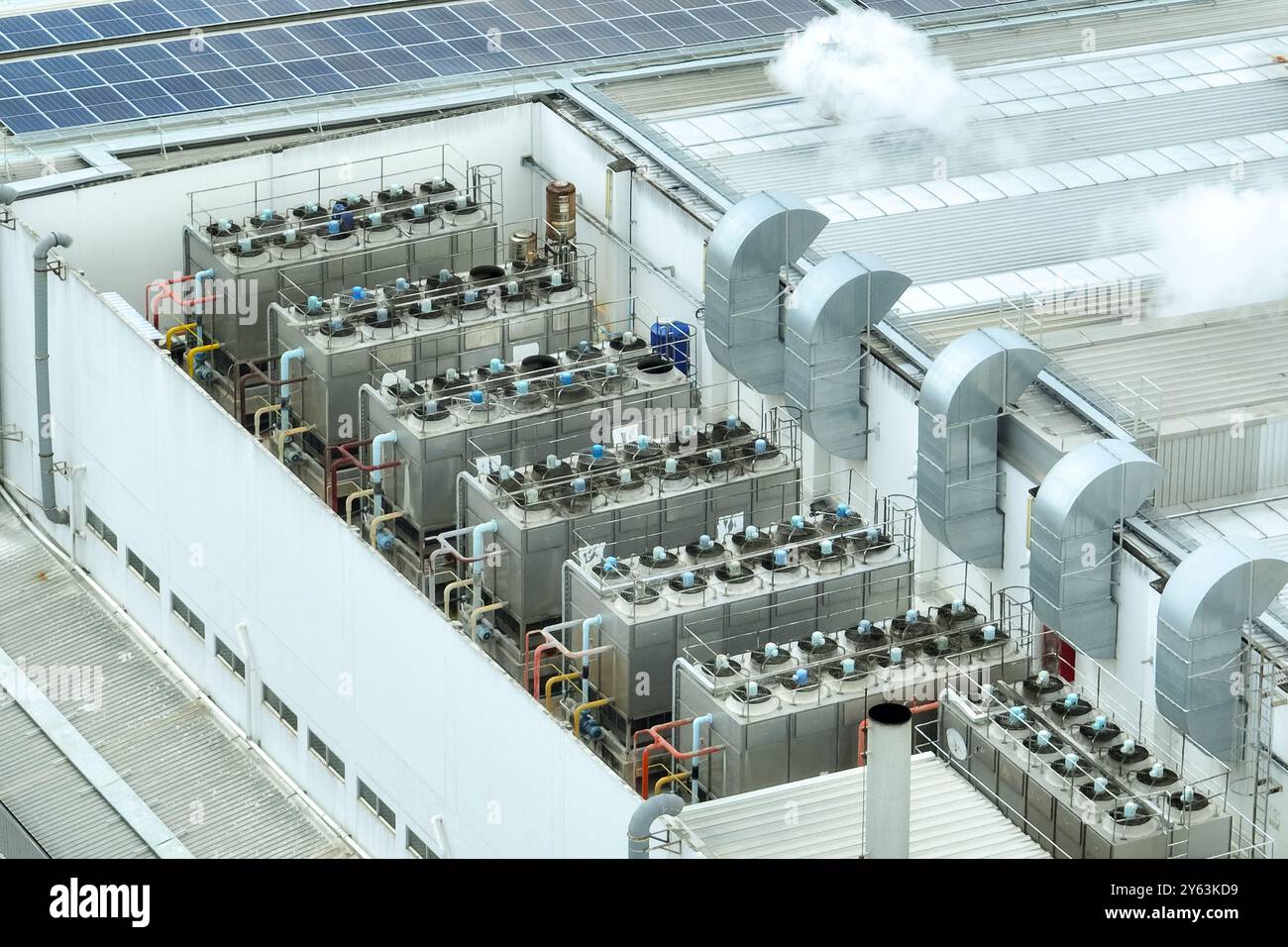 Sustainable industrial rooftop. Aerial view showcasing solar panels ...