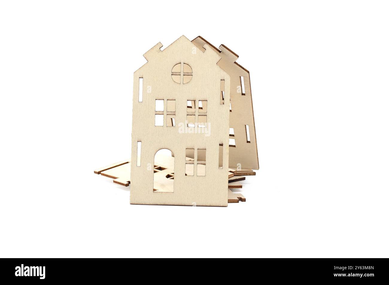 Wooden house model pieces elegantly arranged, highlighting the concept ...