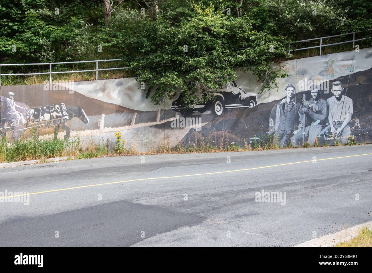 History mural of fishermen sitting on the beach on Blackhead Road in St ...