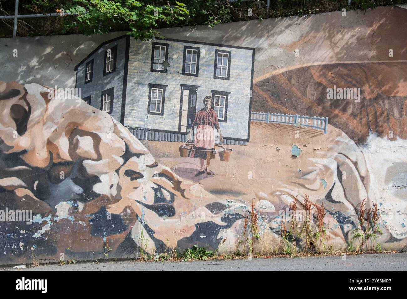 History mural of a working woman carrying pails on Blackhead Road in St ...