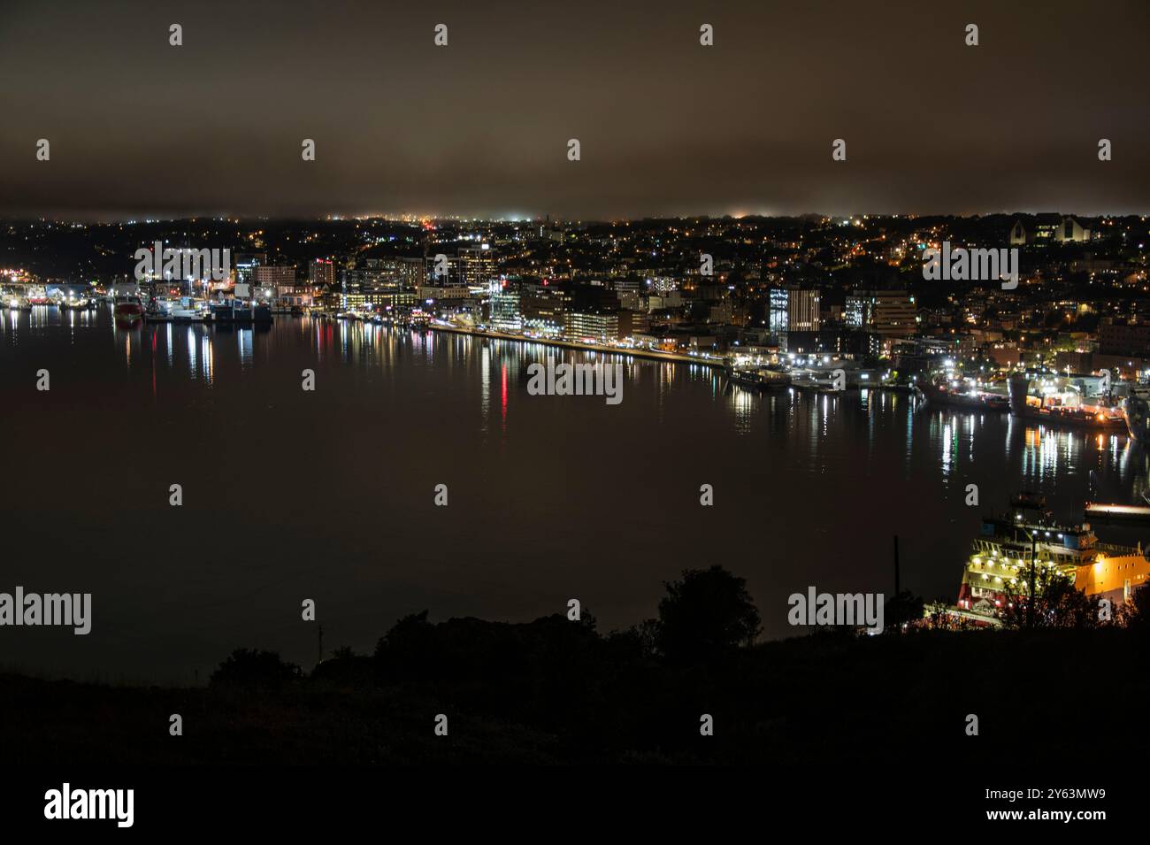 View of harbour and downtown at night in St. John's, Newfoundland ...