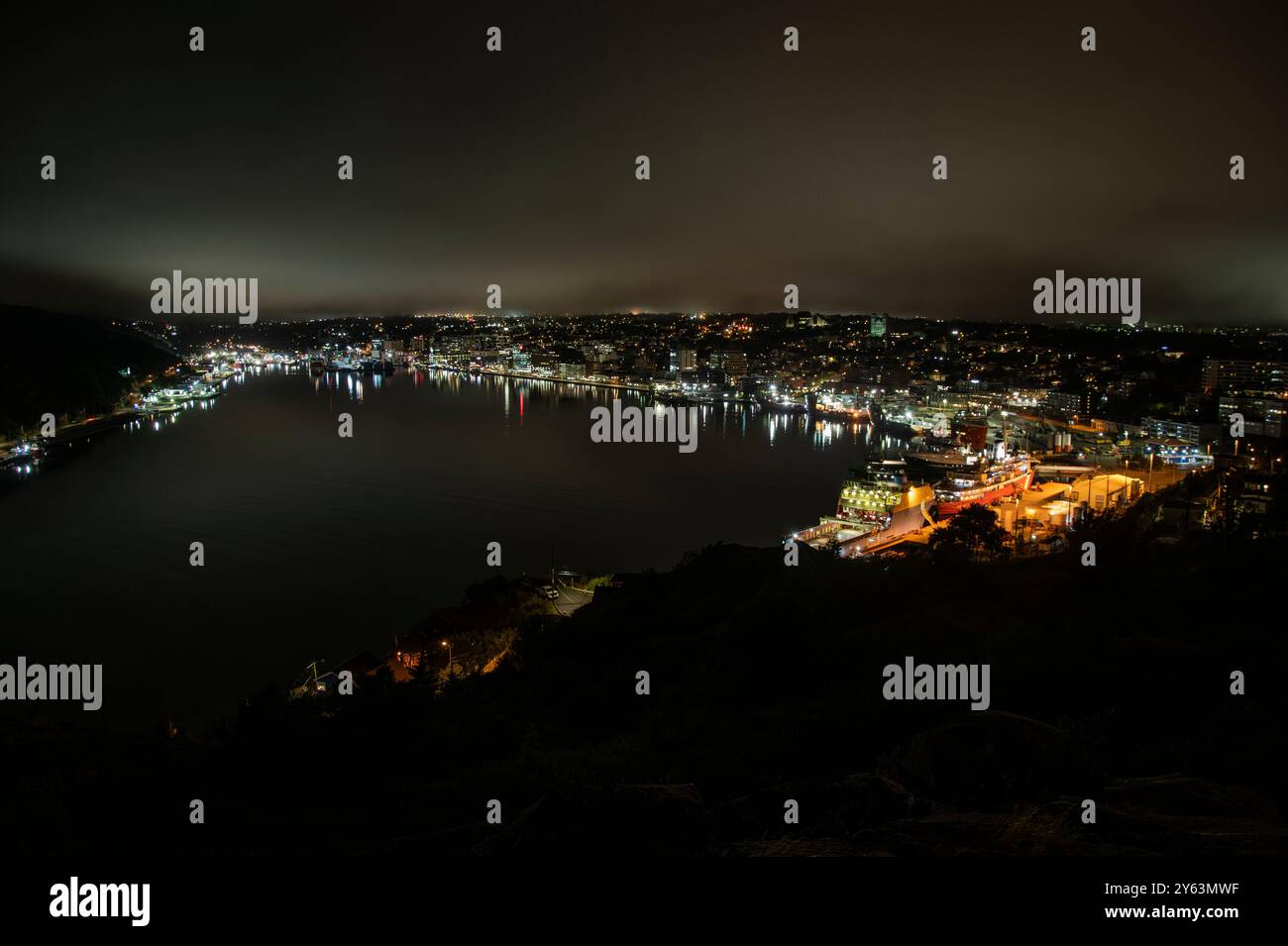 View of harbour and downtown at night in St. John's, Newfoundland ...