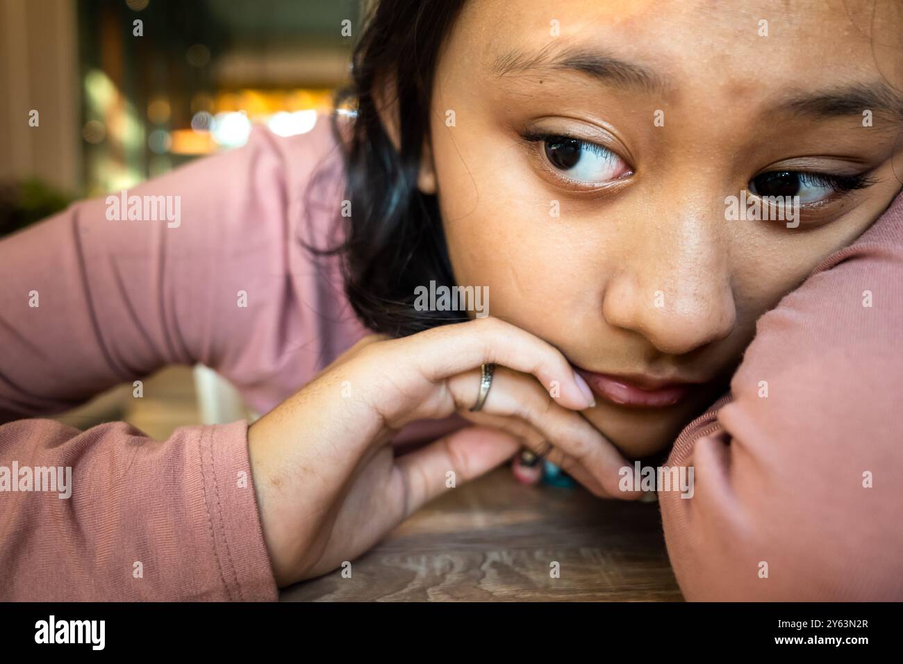 Asian Teenage Girl in a Bad Mood Lying Her Body and Putting Her Arms on ...