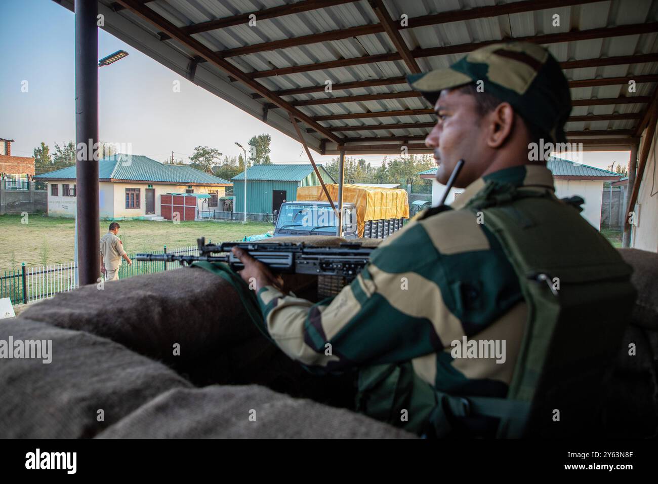 An Indian Border Security Force (BSF) personnel stands alert inside a ...