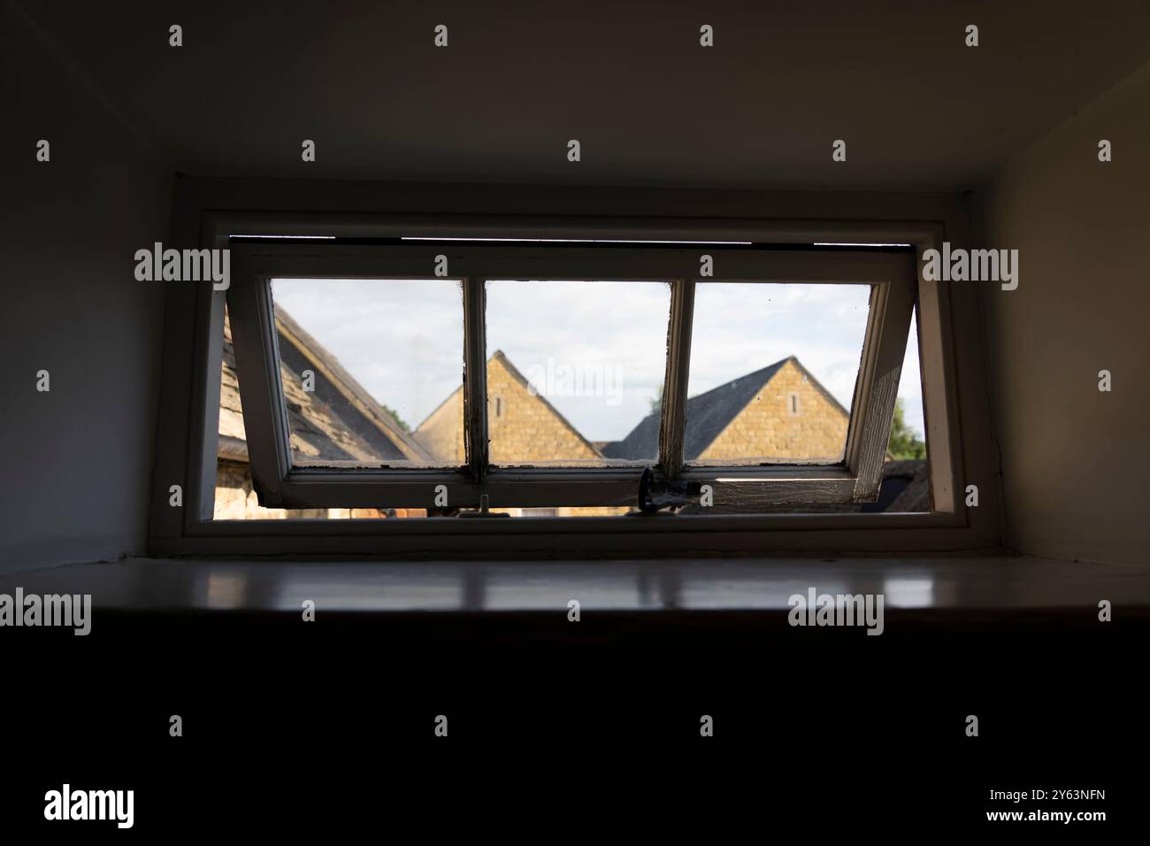 Gables through partly open transom window in Chipping Campden ,The ...