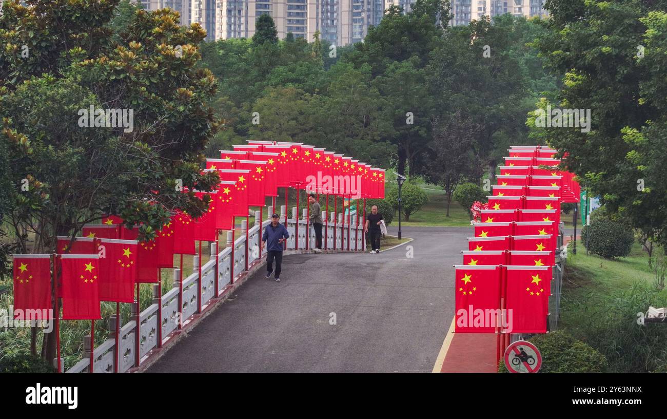 HUAI'AN, CHINA - SEPTEMBER 24, 2024 - National flags installed on both ...
