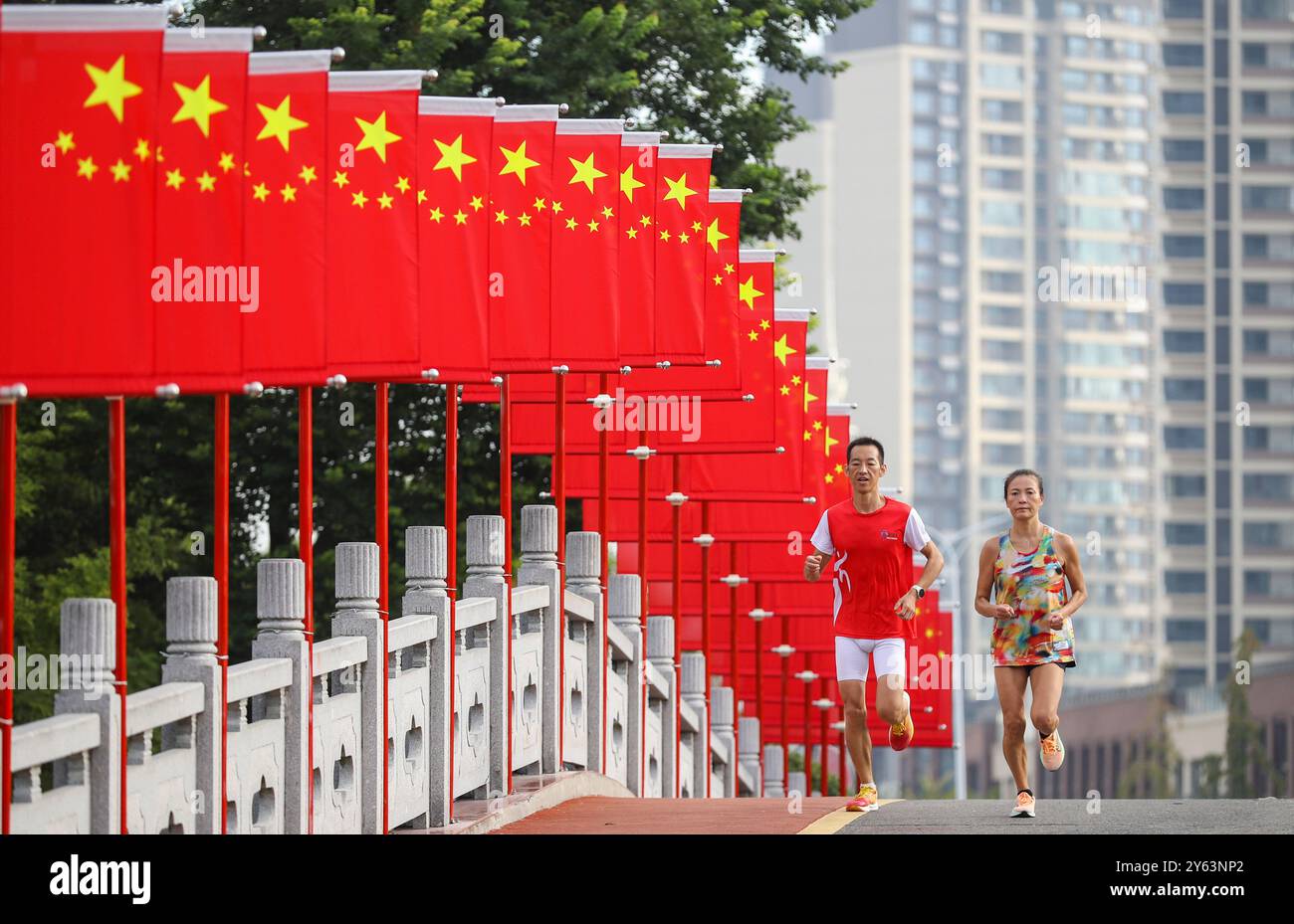 HUAI'AN, CHINA - SEPTEMBER 24, 2024 - National flags installed on both ...