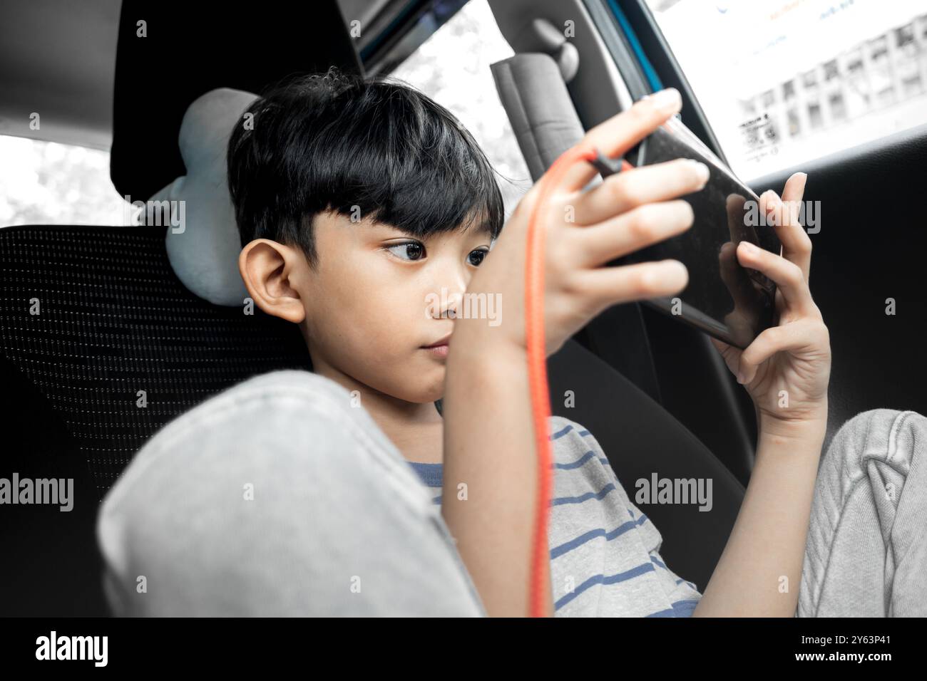 Asian boy playing online games hi-res stock photography and images - Alamy