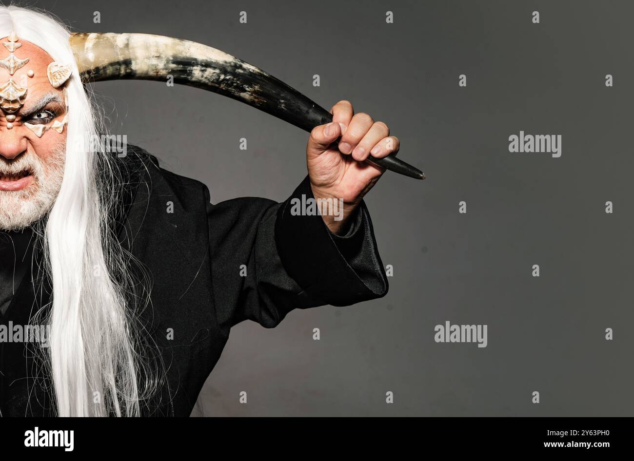 Monster with sharp thorns and warts on face. Wizard demon man with ...