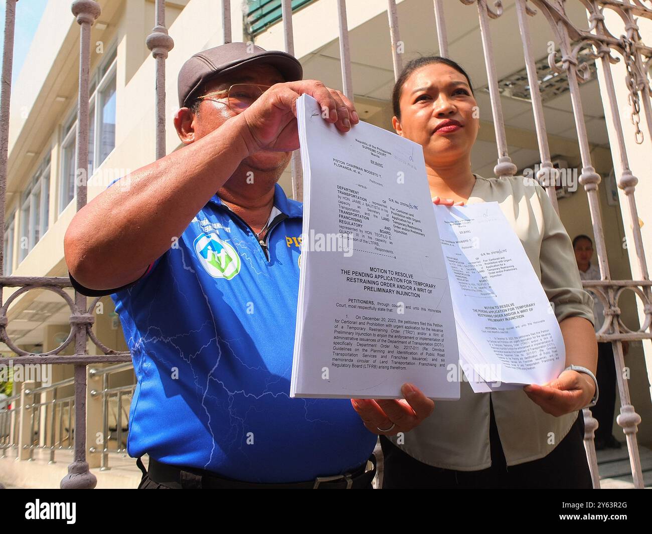 PISTON Transport Group President Mody Floranda with Kristina Conti hold ...