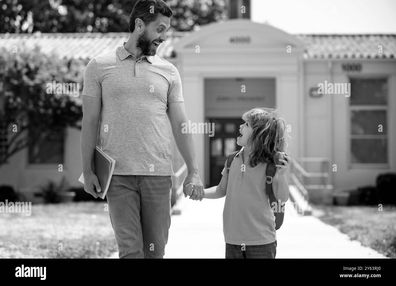 Father and son go to school, education and learning. Parent and pupil ...