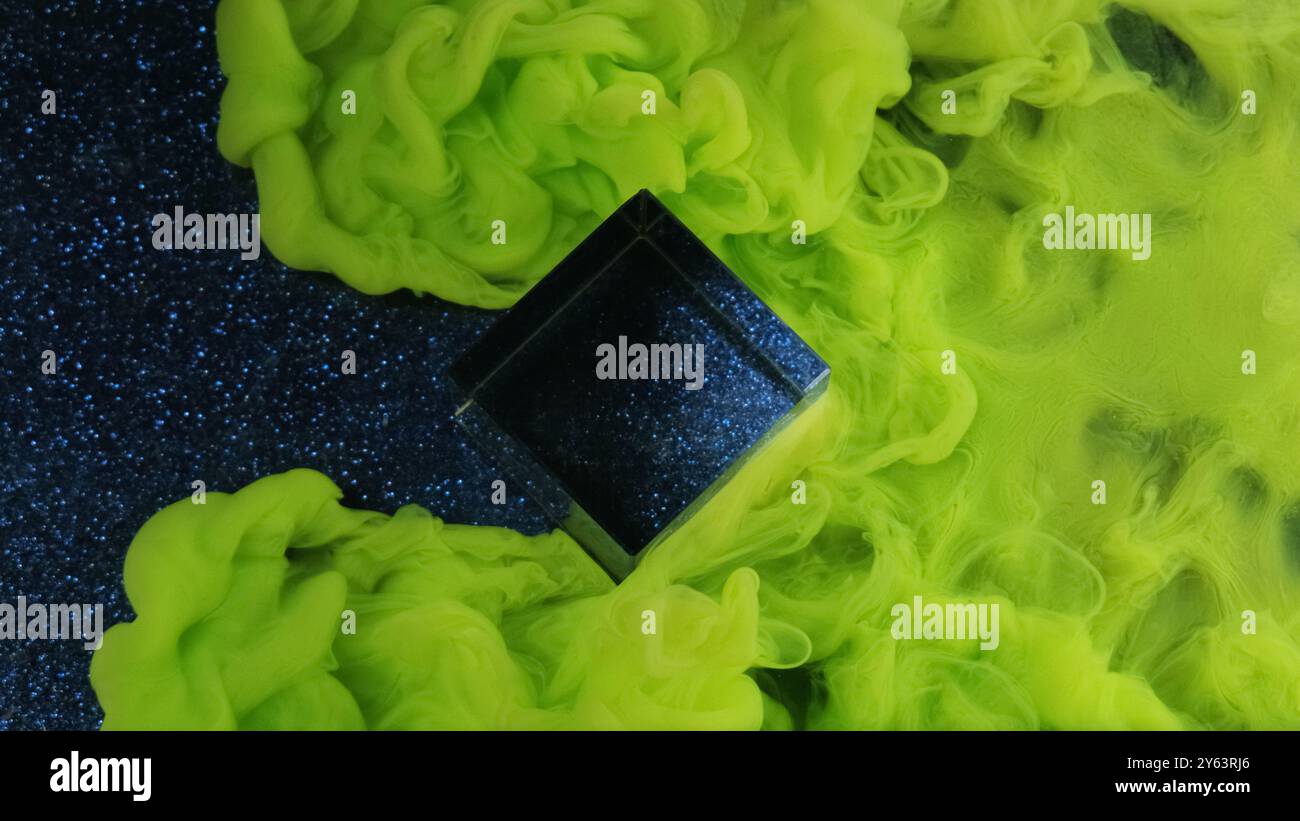 Green mist. Paint water. Black color obsidian shiny cube cosmic spark ...