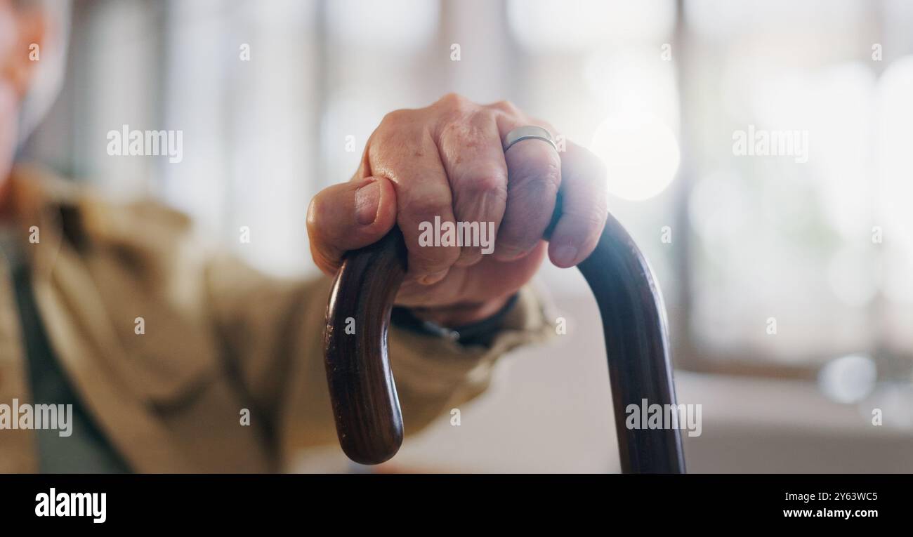 Walking stick, hand and senior man in home with dementia in nursing ...