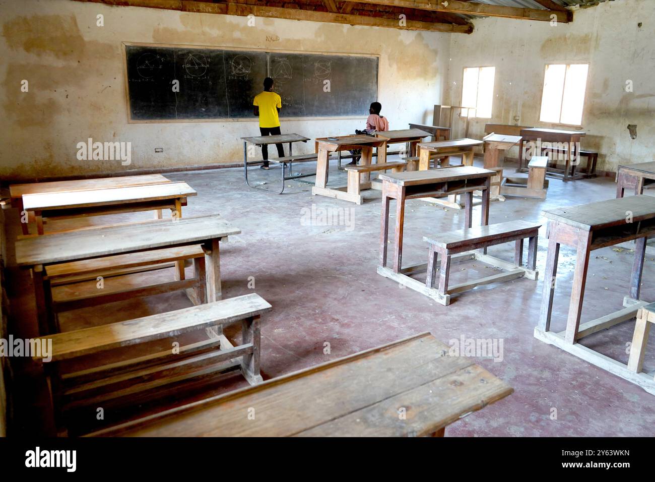 Wooden desks in a rural classroom in an African village Stock Photo - Alamy