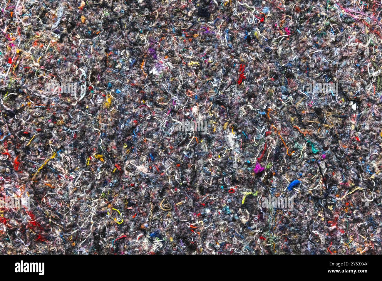Recycled textile insulation fabric made of colorful fibers, background ...