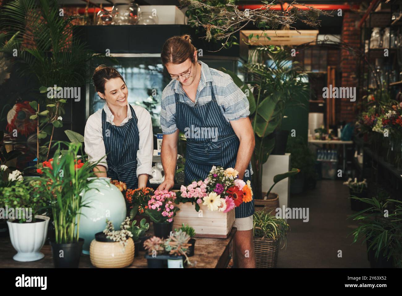 Business owner, flower store and teamwork with smile, employees and ...