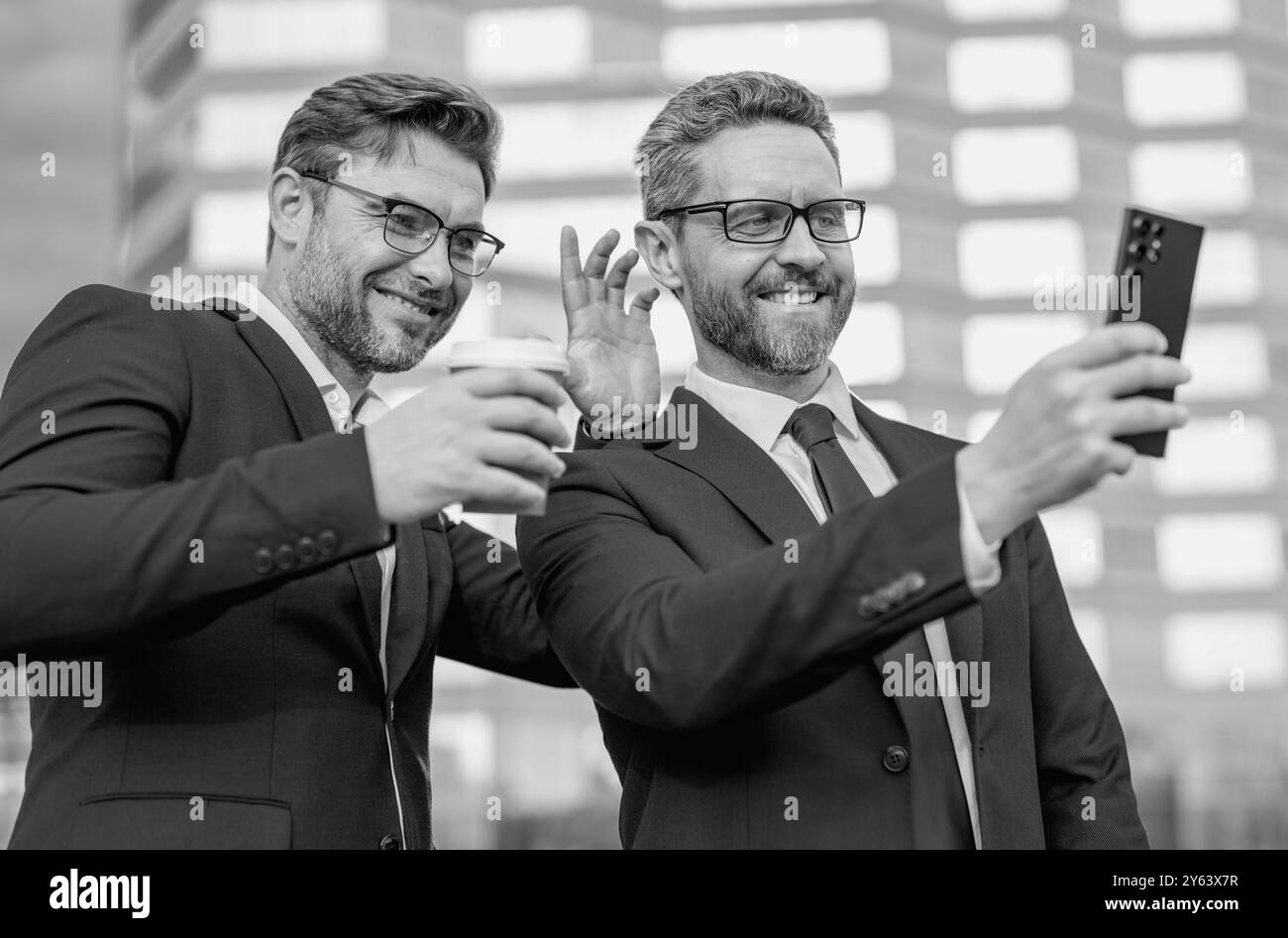 Successful man in suit texting Black and White Stock Photos & Images ...