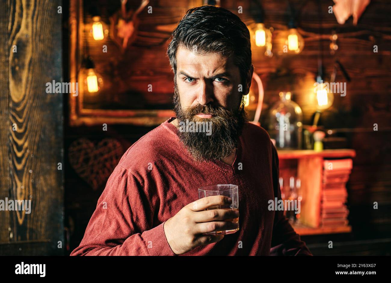 Attractive man with glass of whiskey in his hands. Alcohol addiction ...