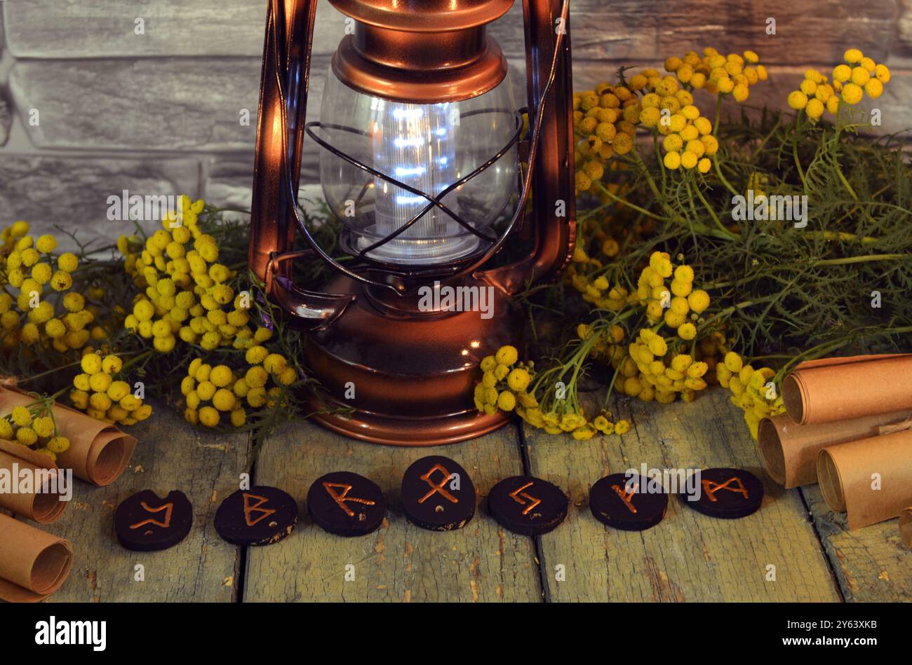 Mystic still life with old lantern, runes, tansy flowers and witchy ...