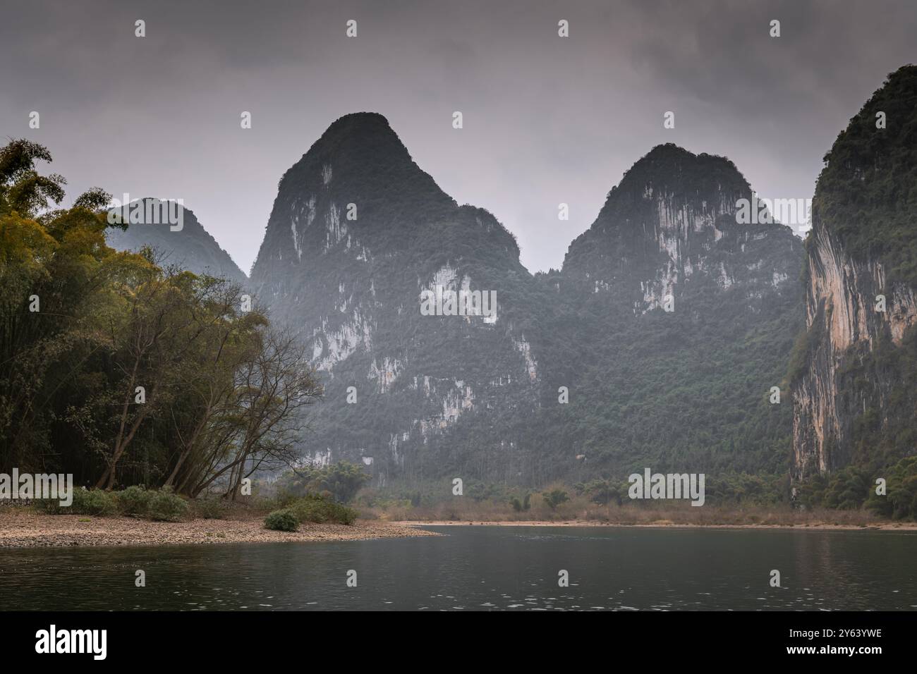 Bamboo and the limestone mountains at the Li river around Xing Ping ...