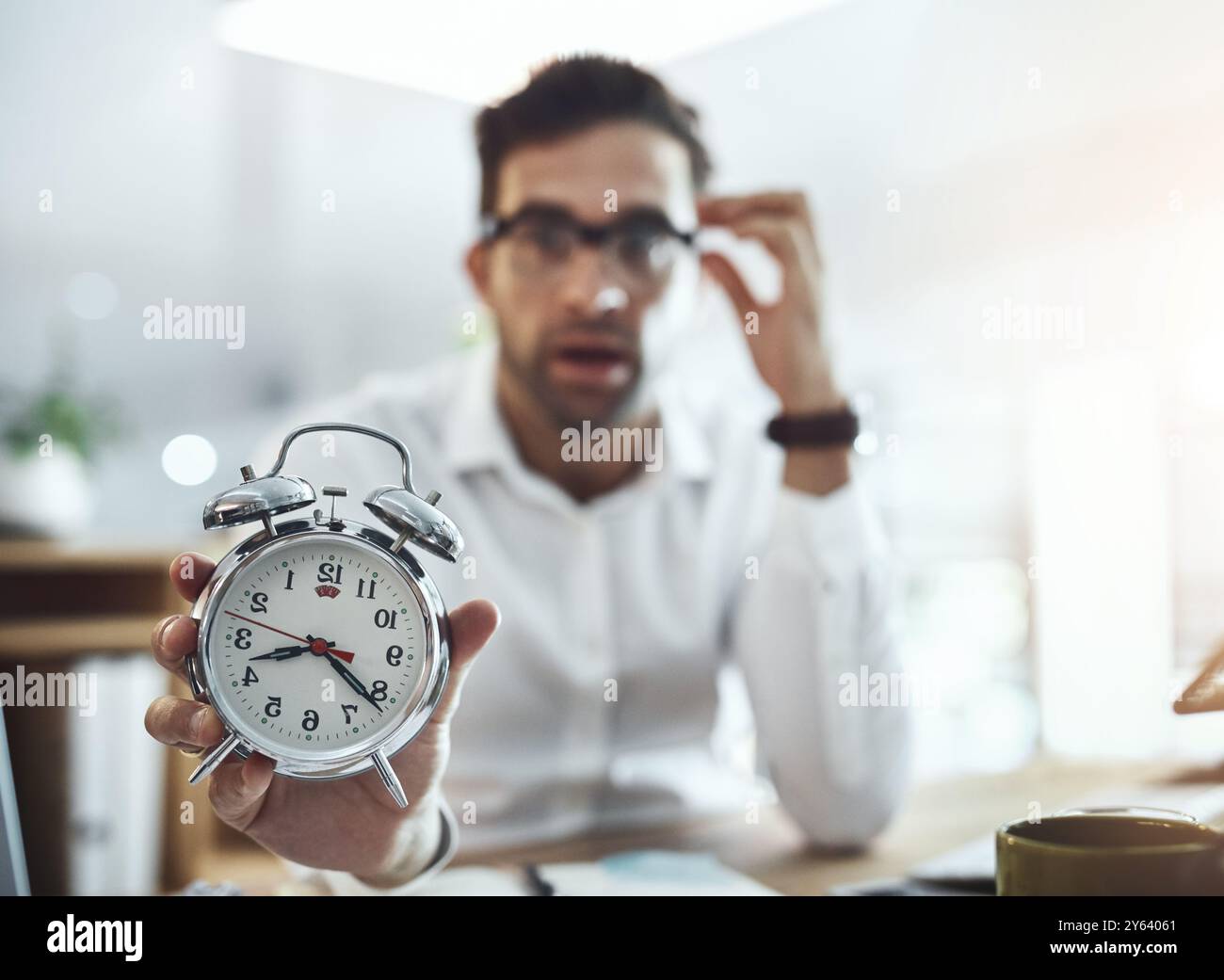 Tired businessman alarm clock hi-res stock photography and images - Alamy