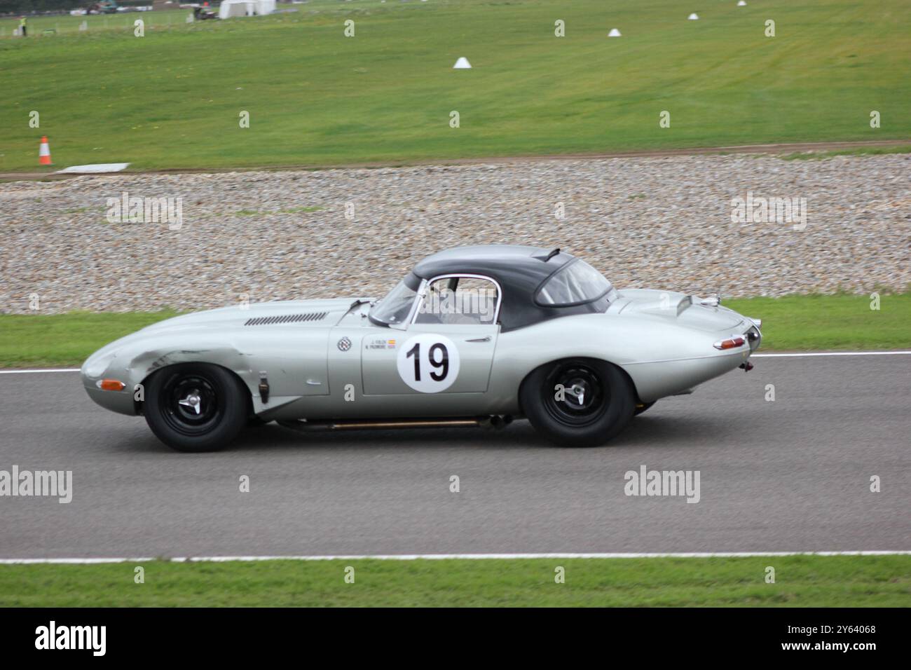 A silver 1961 Jaguar E-type at the Goodwood Revival 2017 during the ...