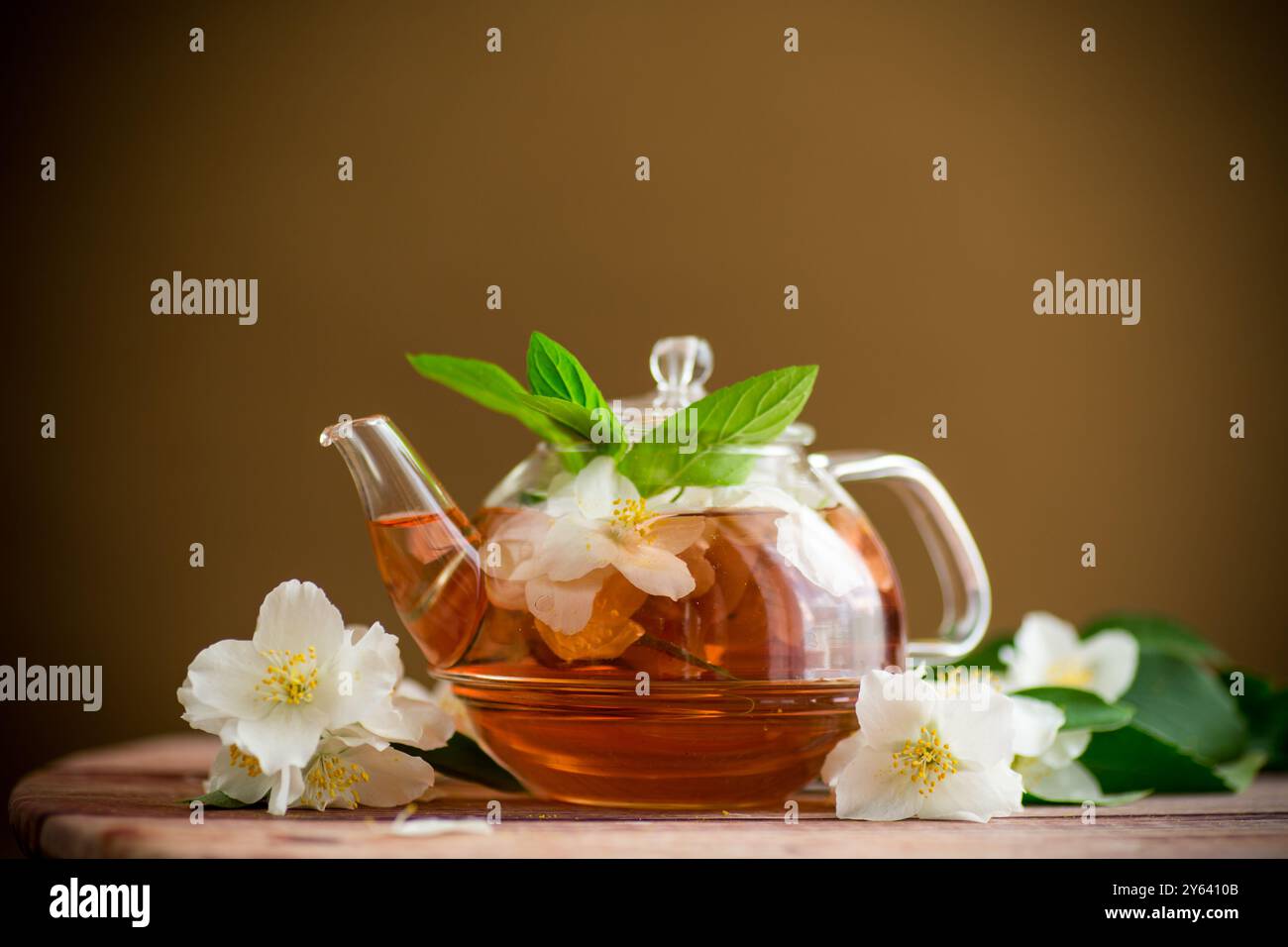 jasmine flower tea in a glass teapot Stock Photo - Alamy
