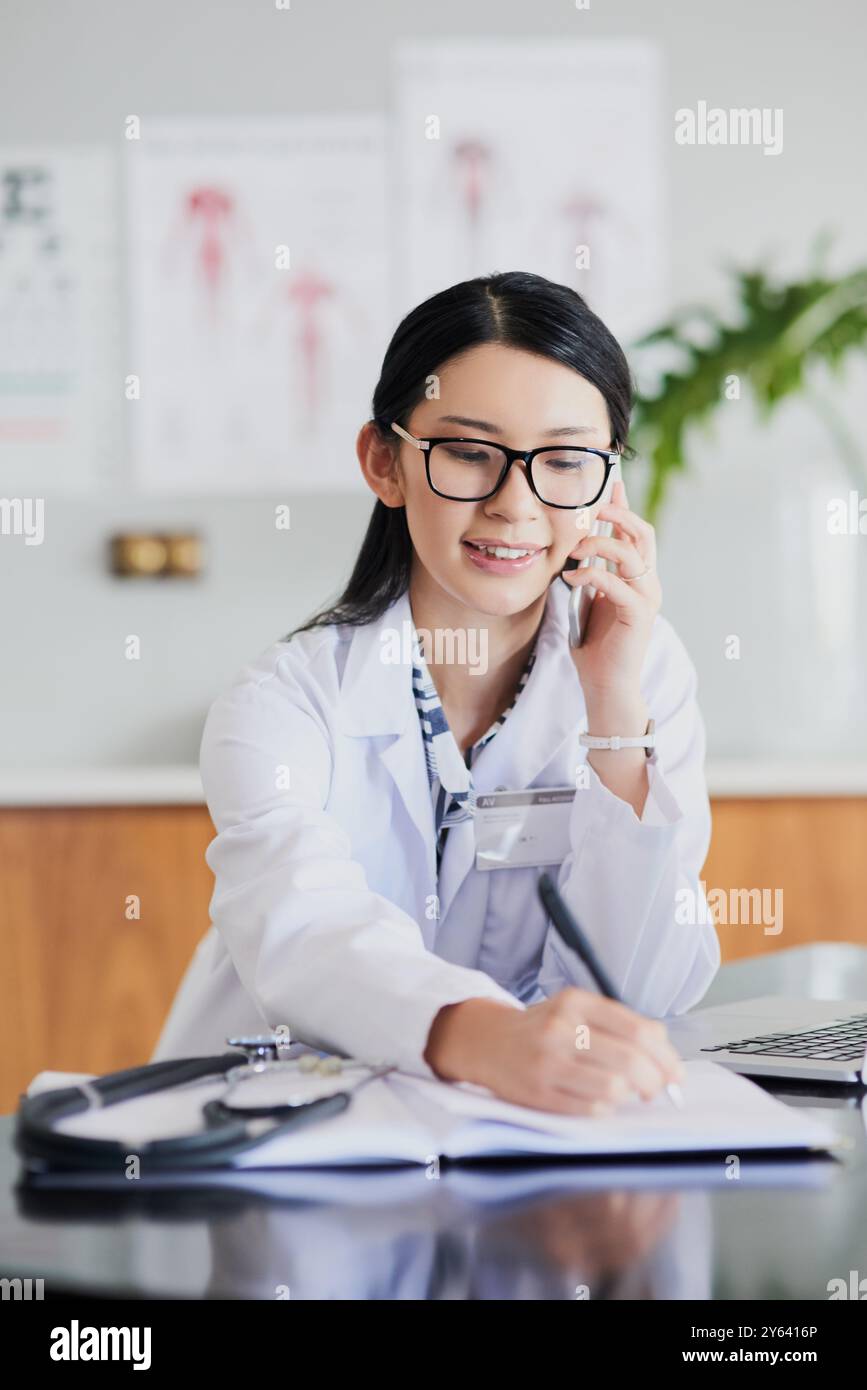 Doctor, consultation and woman with phone call in office for healthcare ...