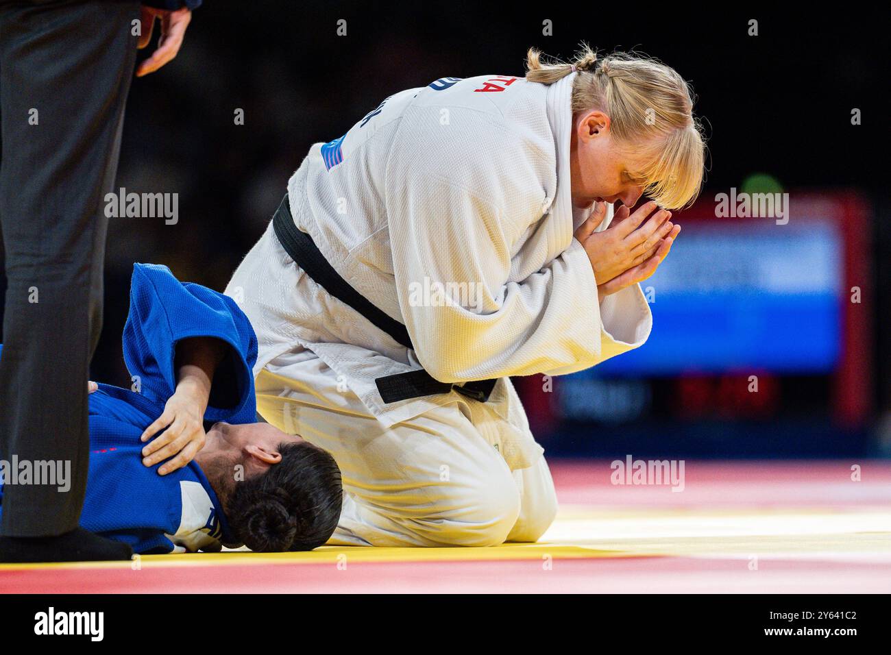 Anastasiia Harnyk (white) of Team Ukraine defeats Erika Zoaga (blue) of Team Brazil in the gold ...