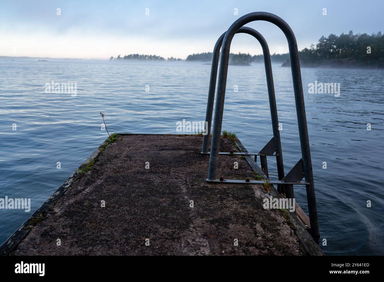 Bathing jetty made of concrete and metal ladder Stock Photo - Alamy
