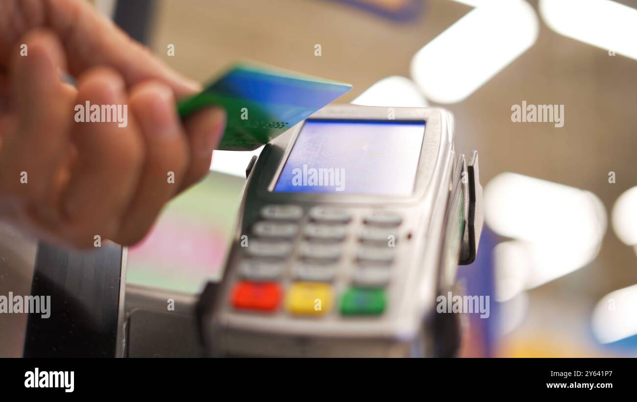 Payment for purchases with a bank card Stock Photo - Alamy