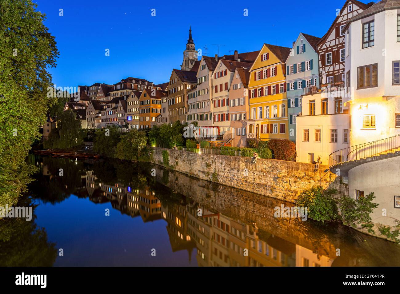 Night shot of historic half-timbered buildings at the riverfront in ...