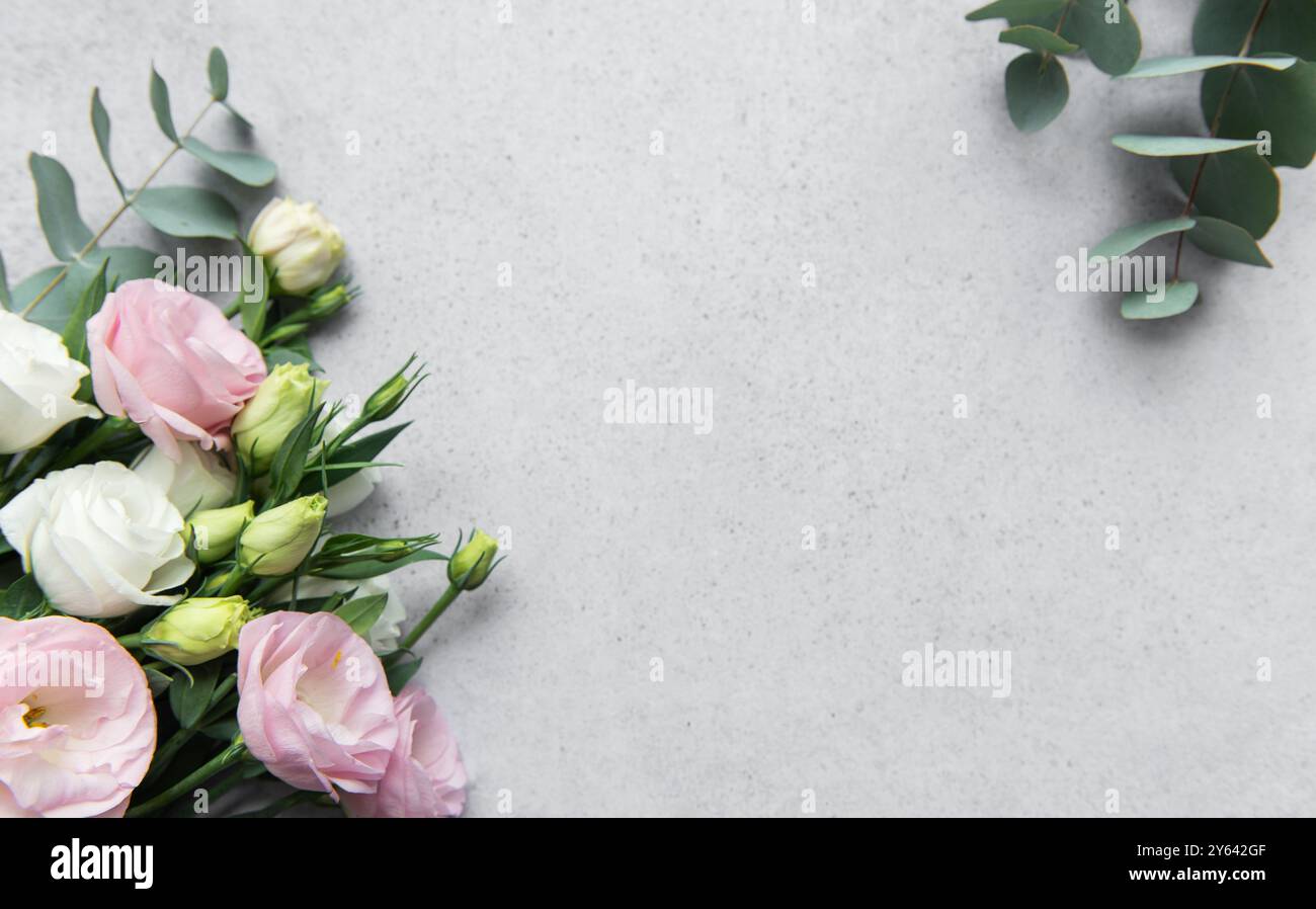 A beautiful assortment of pink, white, and cream flowers are artfully ...